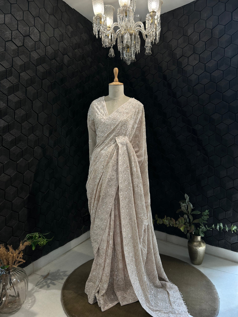 PREMIUM DULL PEACH GEORGETTE CHIKANKARI SAREE WITH STATEMENT FLOWER MO