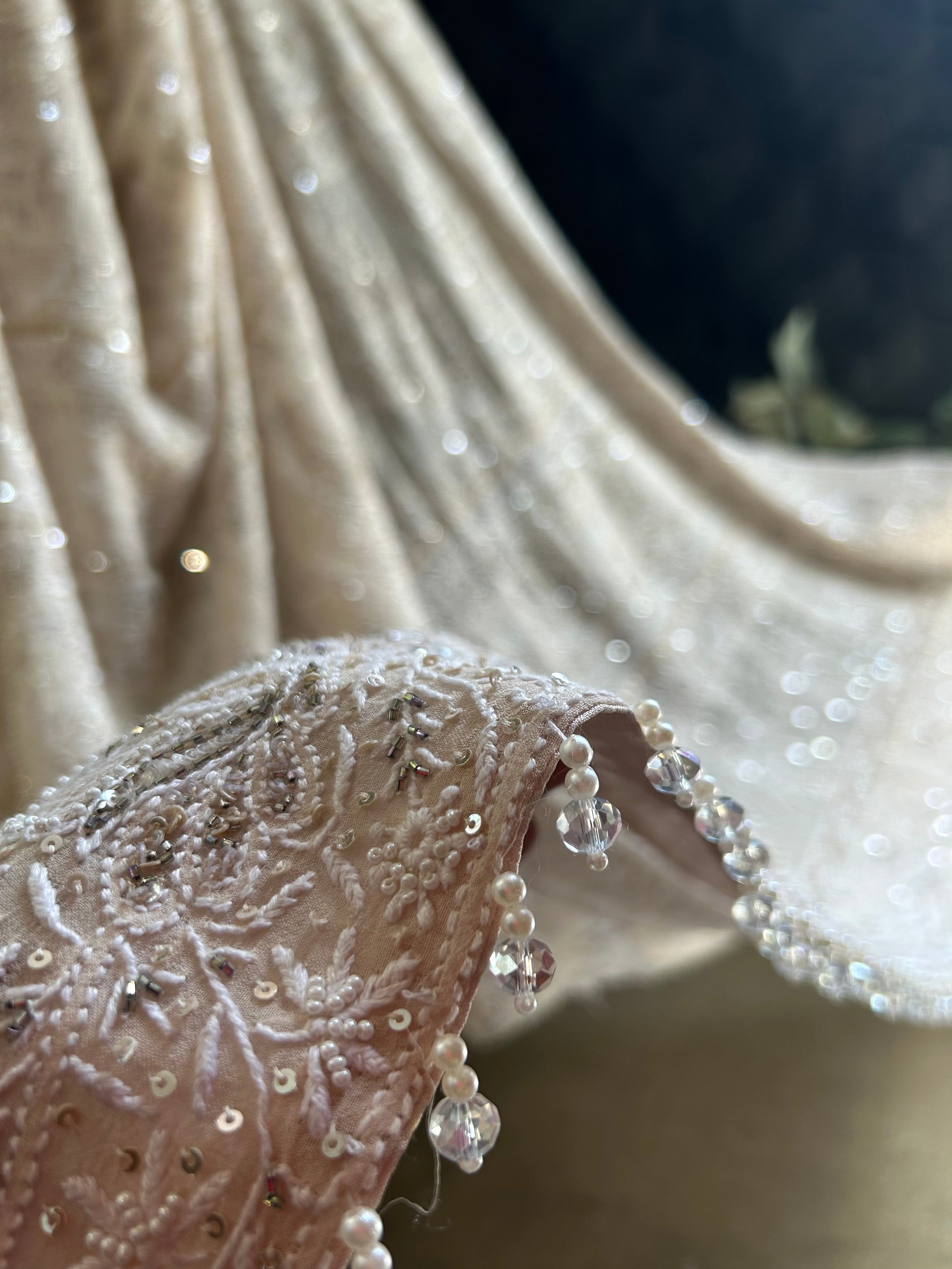 PREMIUM DULL PEACH GEORGETTE CHIKANKARI SAREE WITH STATEMENT FLOWER MO